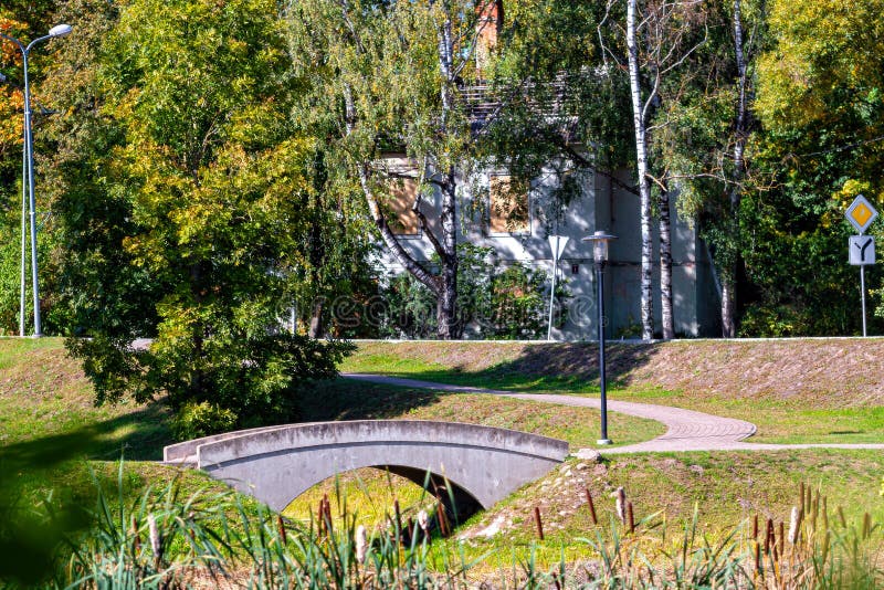 Small City Landscape with Pedestrian Bridge and Paved Walkway Stock ...