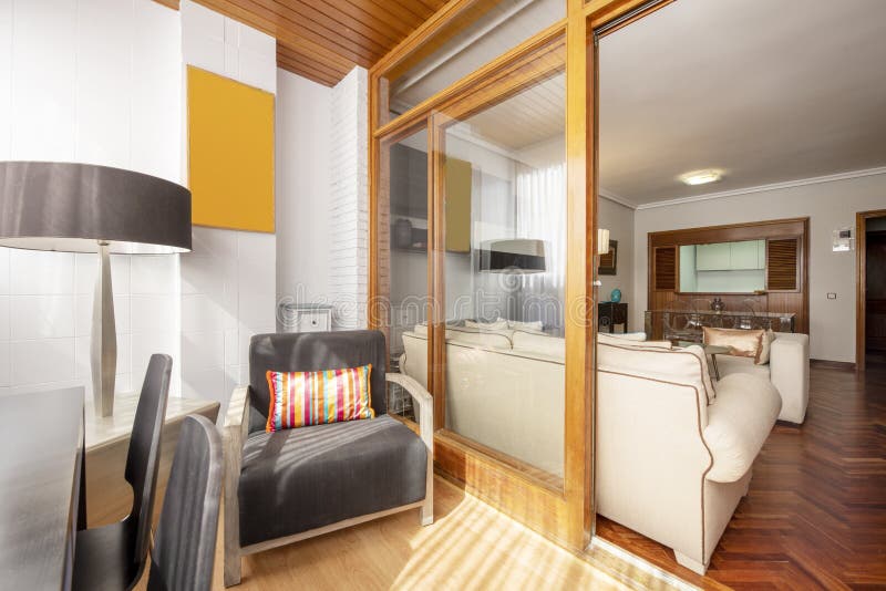 A Small Closed Terrace with Glazing Next To a Spacious Living Room with ...