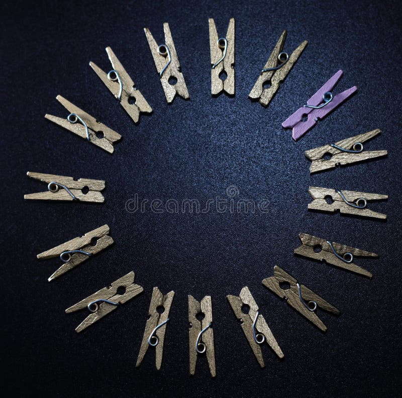 Small Clothes Pins on Clothespins in a Circular Design Against a Blue ...