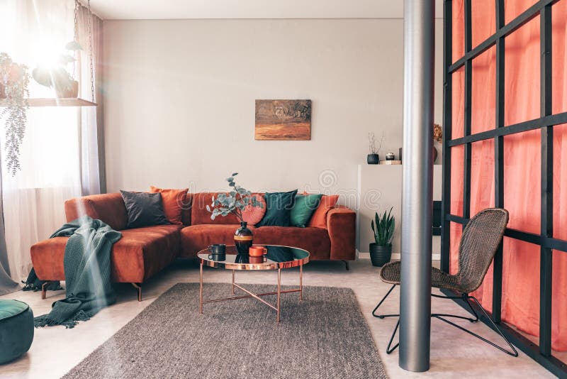 Coffee Table in Front of Comfortable Corner Sofa in Autumn Colored ...