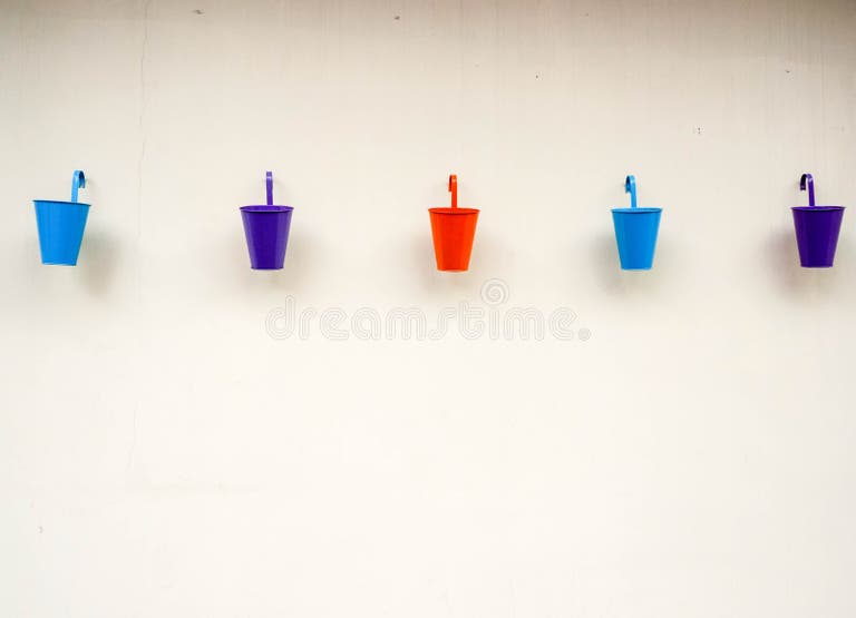 Small Color Buckets on Wall Background Stock Image - Image of color ...