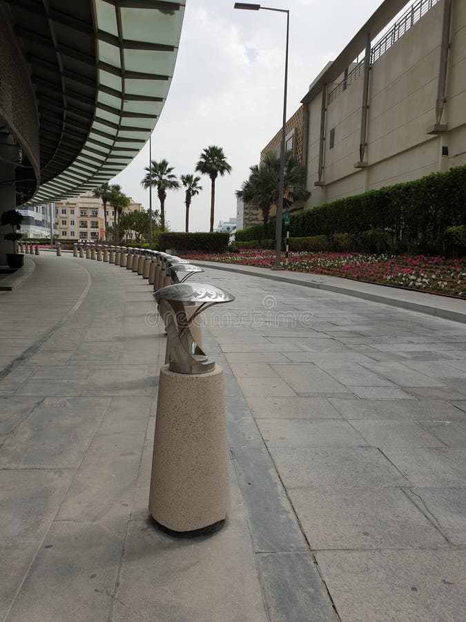 Small Columns Stacked on the Sidewalk Next To One of the Buildings ...