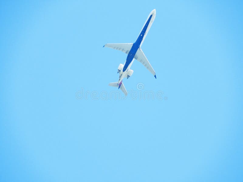 Small Commuter Jet Flies Overhead To Land at Nearby Airport Stock Image ...