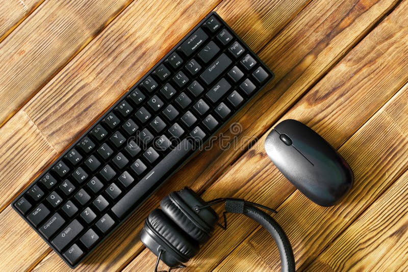 Small Compact Black Computer Keyboard Next To a Computer Mouse and ...
