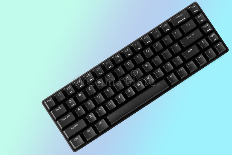 Small Compact Black Gaming Computer Keyboard on a Blue Gradient ...