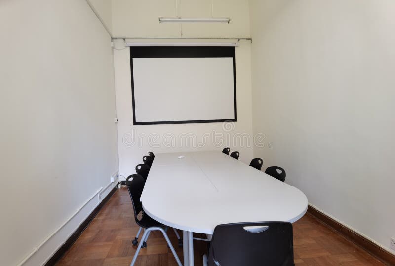 Small Conference Room with Project Screen, Table and Chair Stock Photo ...