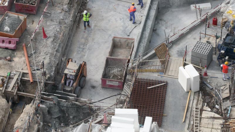 Small Construction Loader Truck Moving and Loading Dirt in a Big ...