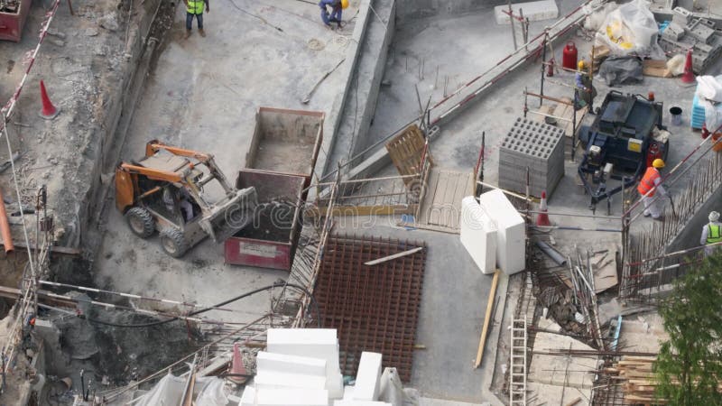 Small Construction Loader Truck Moving and Loading Dirt in a Big ...