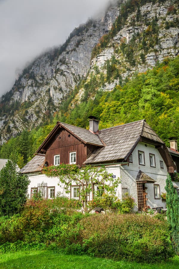 Small Cottage in the Alps with a Tree Stock Photo - Image of garden ...