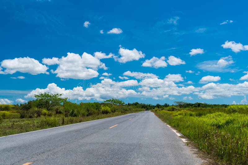 Small Country Road with Blue Sky Background Stock Image - Image of ...