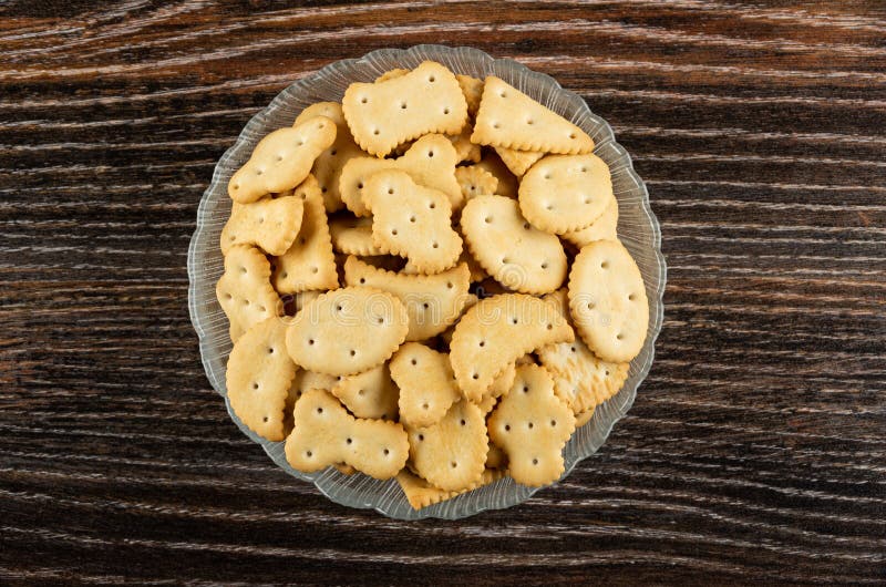Crackers Different Shape in Bowl on Wooden Table. Top View Stock Image ...