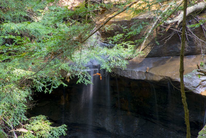 Large Pool of Water at Base of Cliff Stock Photo - Image of cave, large ...