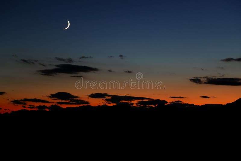 Small Crescent Moon during Sunset and the Colors of the Sky Stock Image ...