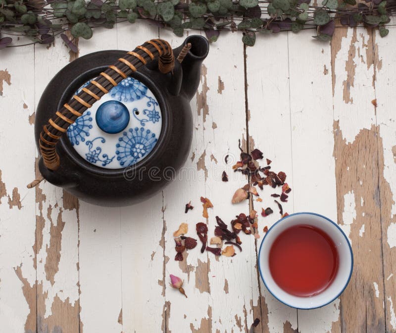 A Small Cup of Rosehip Tea from Above with Oriental Teapot Stock Photo ...