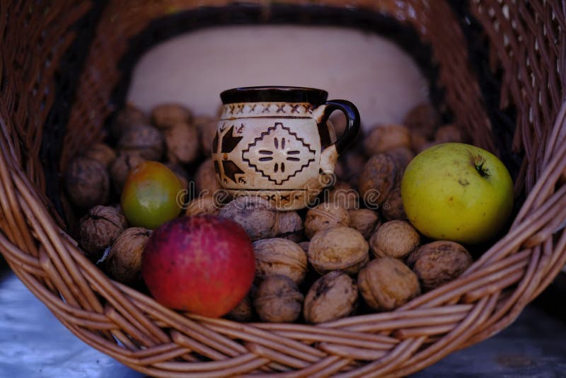 Small Cup with Traditional Ornaments in a Basket Full of Walnuts and ...