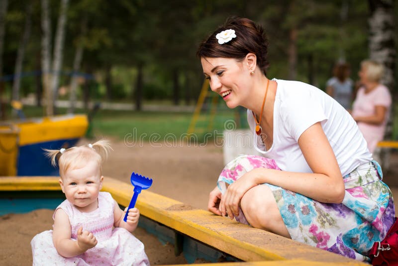 Small Cute Baby and Nice Mom Stock Photo - Image of green, love: 89458878