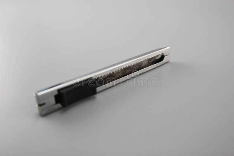 A Small Cutter is Placed on a Gray Background. Stock Photo - Image of ...