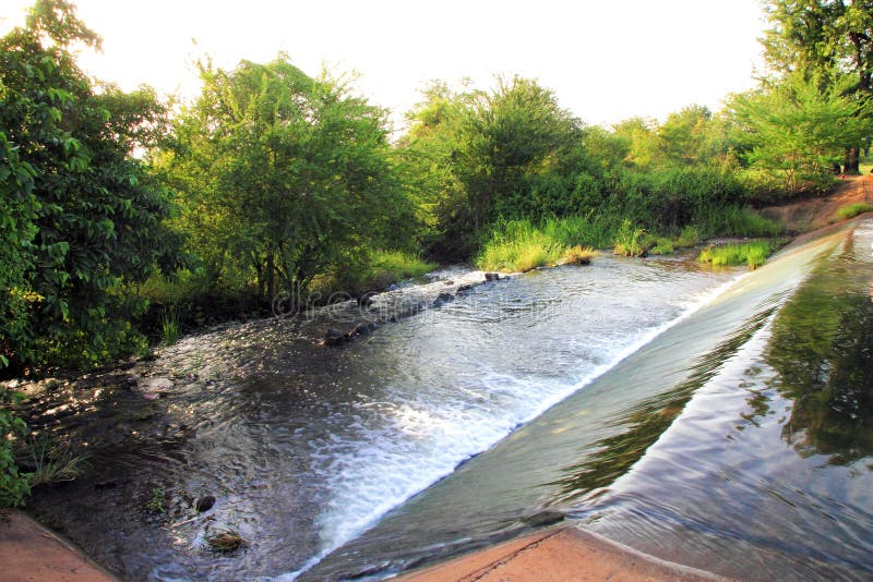 Small dam in country side stock image. Image of flowing - 25630097
