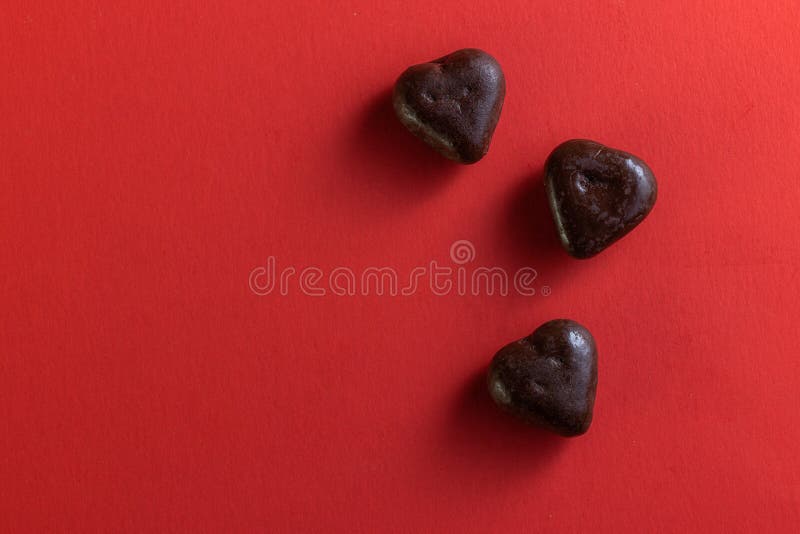 Small Dark Chocolates on Red Stock Photo - Image of reminder, february ...