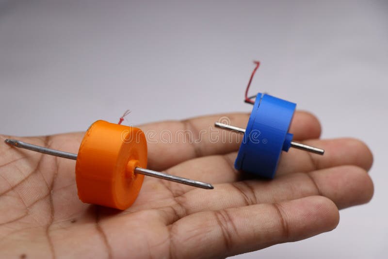 Small Dc Motor with Plastic Frame Having Long Shaft Held in Hand Stock ...