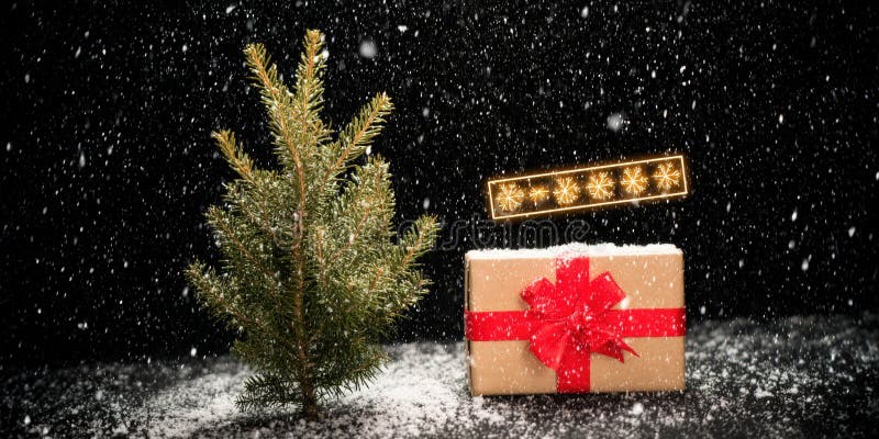 Small Decorated Christmas Tree and Wrapped Gift Box Placed on Fresh ...