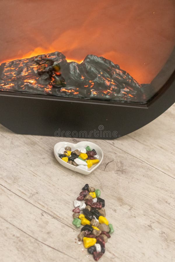 Small Decorative Fireplace with Various Sweets and Reflections Stock ...
