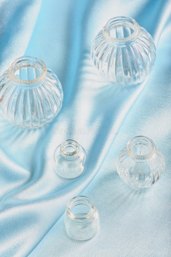 Small Decorative Flower Vases Stand on Blue Satin Fabric Stock Photo ...