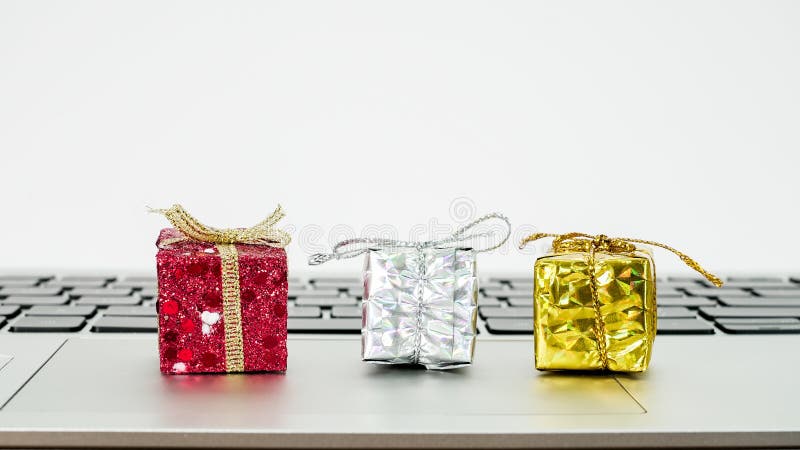 Small Decorative Gift Boxes Placed on a Laptop Keyboard during a ...
