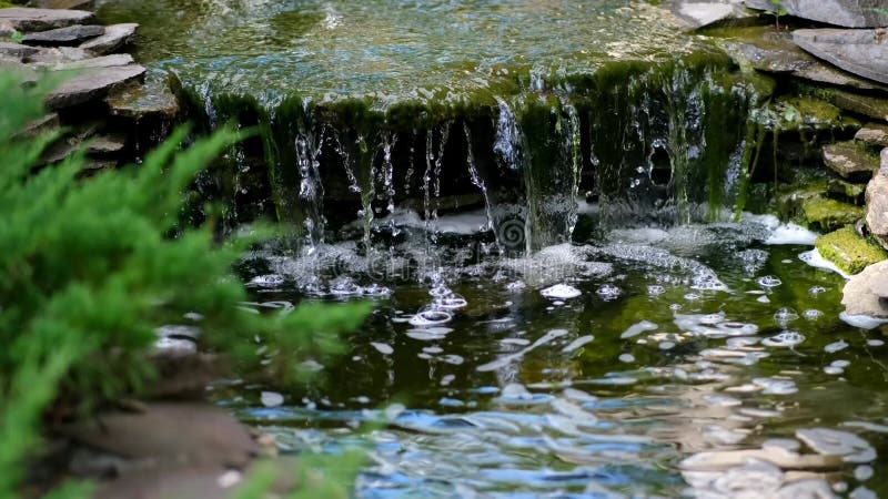 A Small Decorative Waterfall in the Park . Landscape Design Stock ...