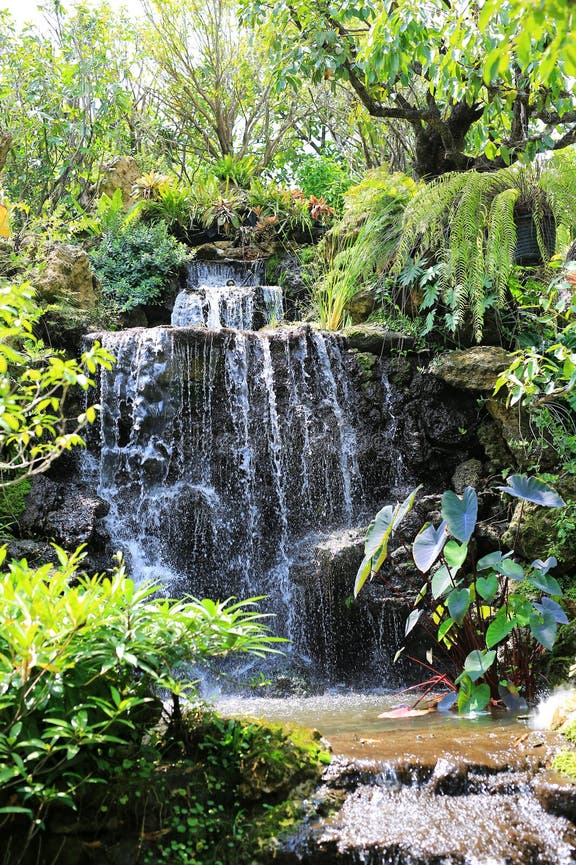 Small Decorative Waterfall in the Public Garden Stock Photo - Image of ...