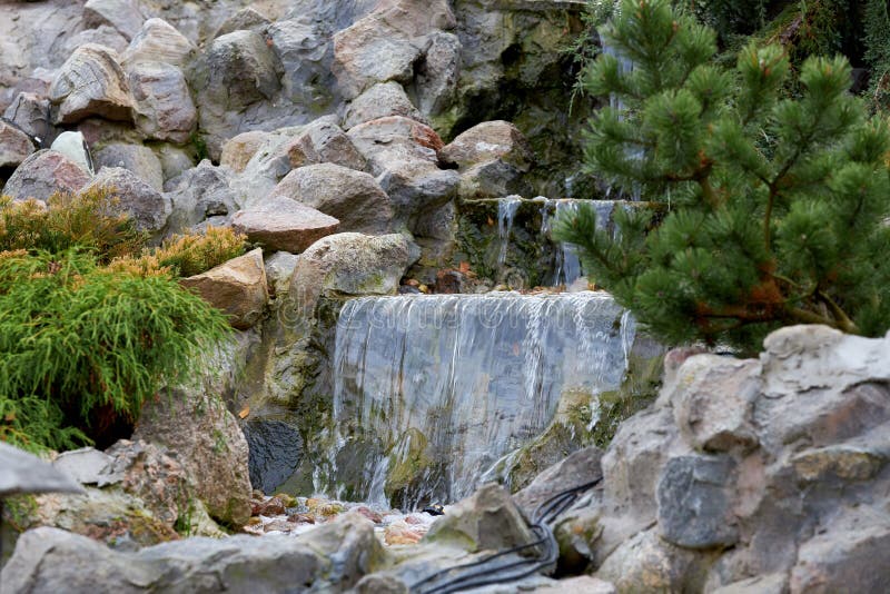 Small decorative waterfall stock photo. Image of outdoor - 259931594