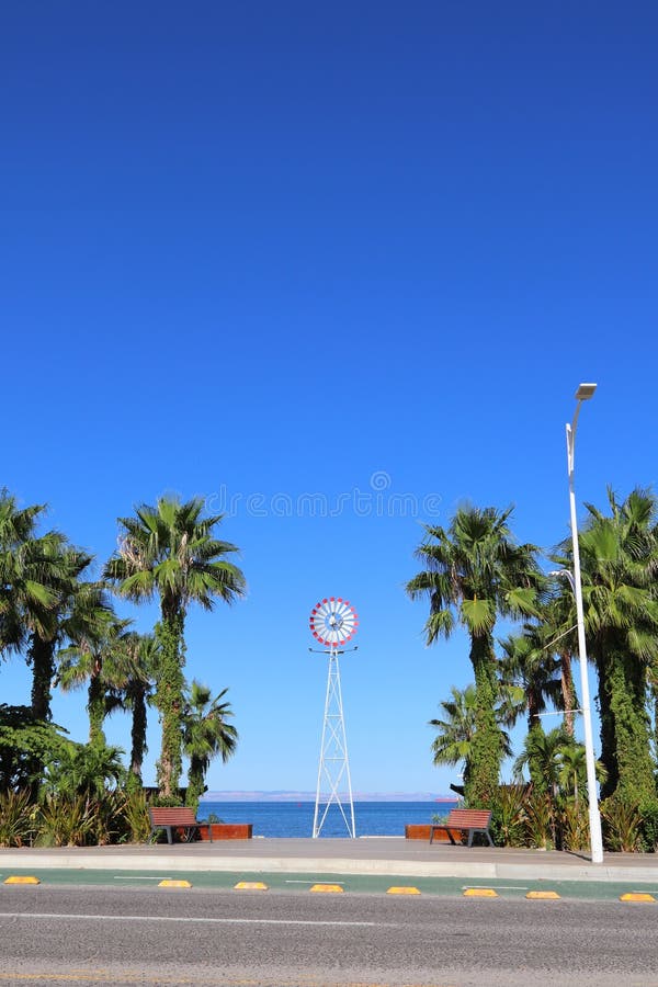 A Small Decorative Windmill in the Middle of Palm Trees. Stock Image ...