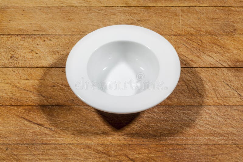 Small Deep Plate on Cutting Board from Side Stock Image - Image of ...