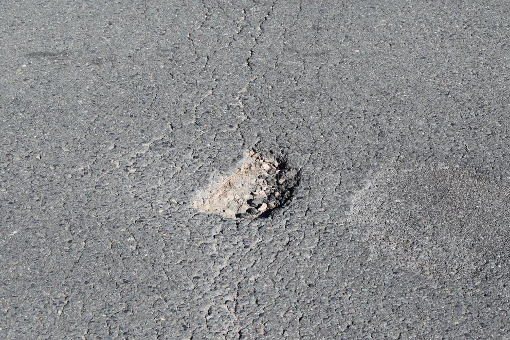 Deep pothole stock image. Image of sidewalk, road, pothole - 289838583