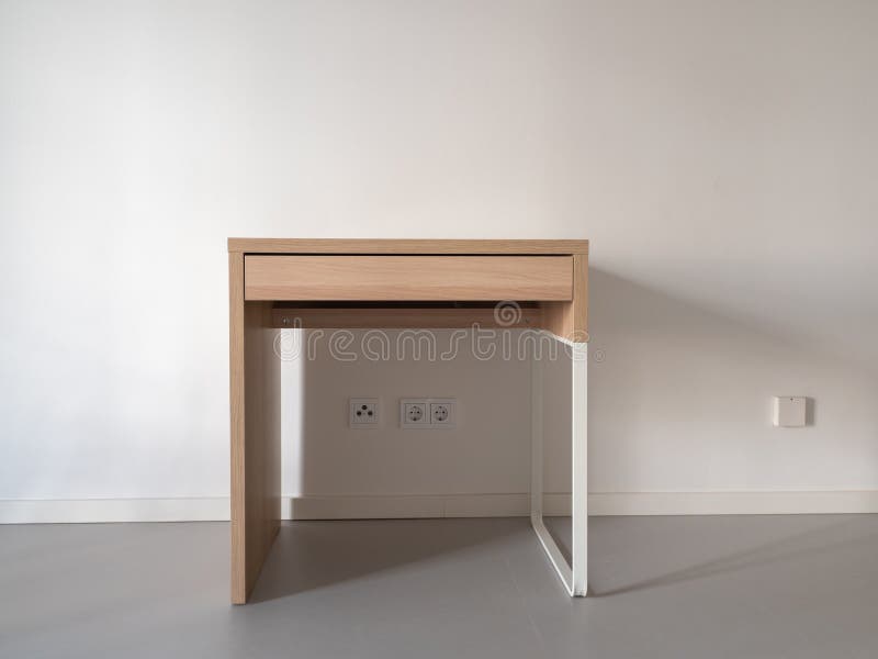 A Small Desk Against a White Wall. Stock Image - Image of house, brown ...