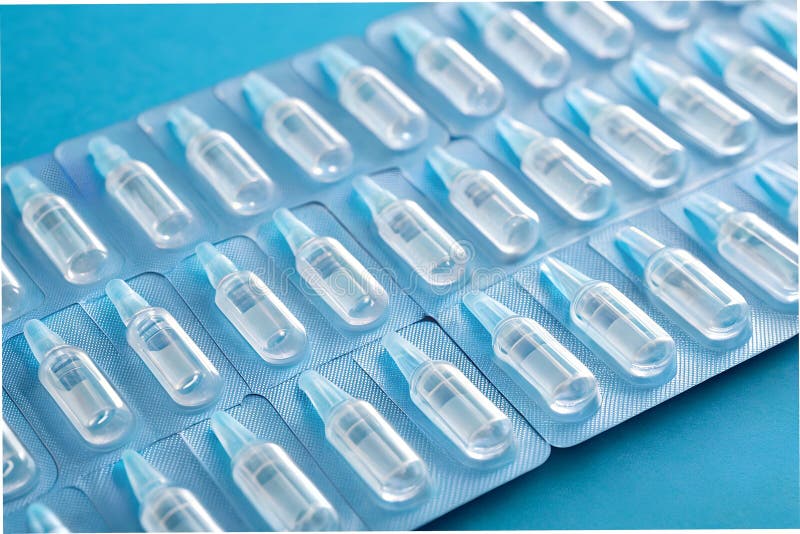 Small Disposable Plastic Ampoules Containing Eye Drops Arranged in a ...