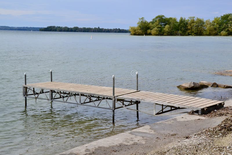 Small Dock Along Water’s Edge Trail and View of Bay Stock Image - Image ...