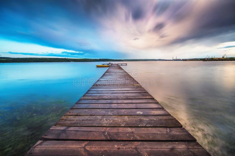 The Wooden Bridge in the Lake Stock Image - Image of reflection, cloudy ...