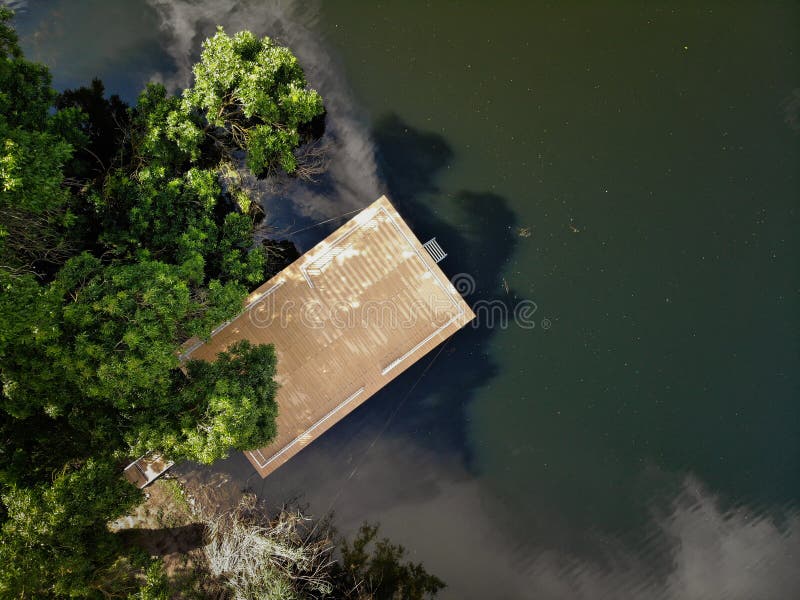 Small Dock on Calm River stock photo. Image of sunset - 320100790