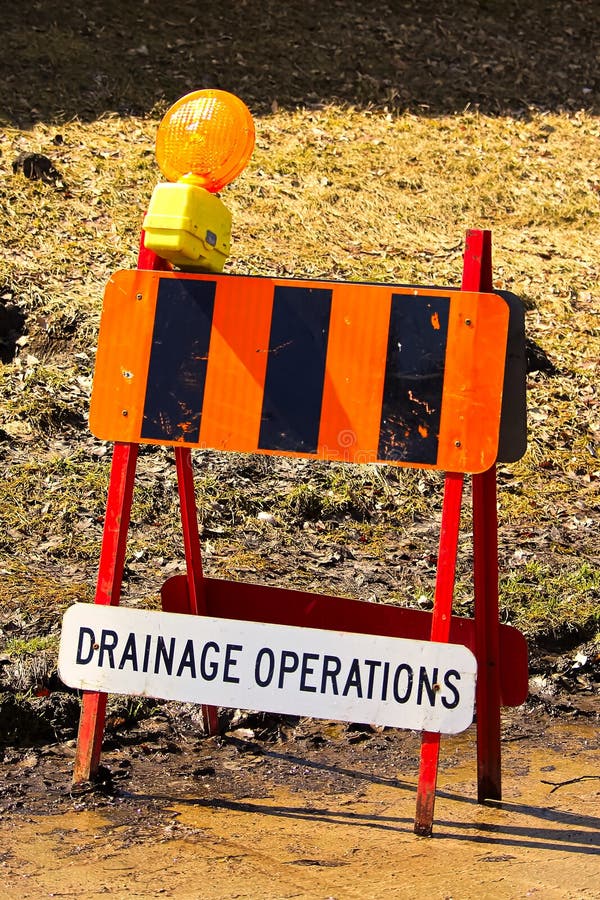 A Small Drainage Operations Obstruction Sign in Spring Stock Photo ...