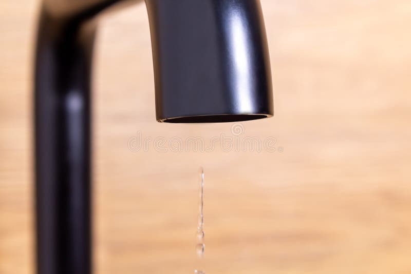 Small Drop from Tap. Saving Water Concept. Stock Photo - Image of black ...