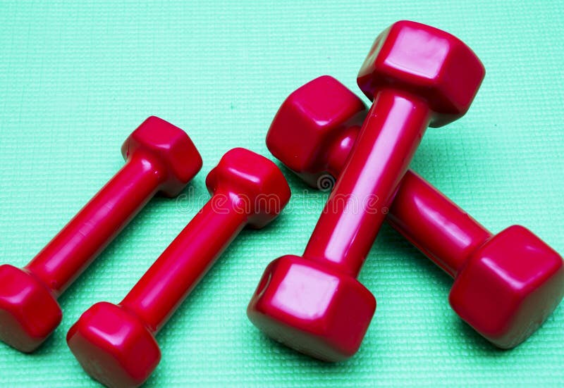 Small Dumbbells on Green Background Stock Image - Image of healthy ...