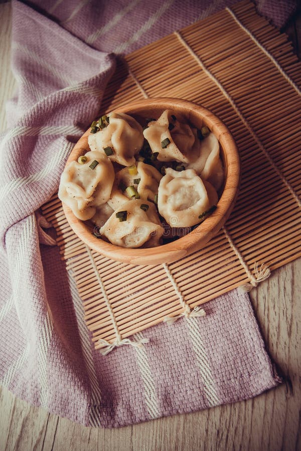 Small dumplings in bowl stock photo. Image of culinary - 64231114