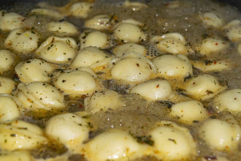Small Dumplings are Cooked in a Pan with Spices. Close Up Stock Photo ...