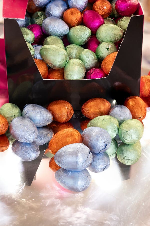 Small Easter Chocolate Eggs in Various Colours Coming Out of Their ...