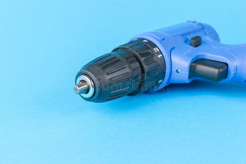 A Small Electric Screwdriver Screwdriver on a Blue Background Stock ...