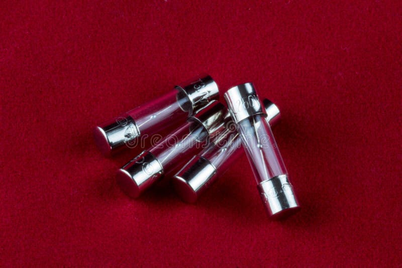 Small Electrical Fuses on a Red Background Stock Image - Image of ...