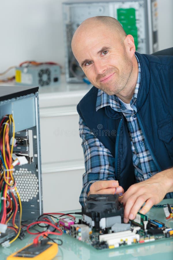 Electronic parts assembler stock image. Image of industrial - 196366269