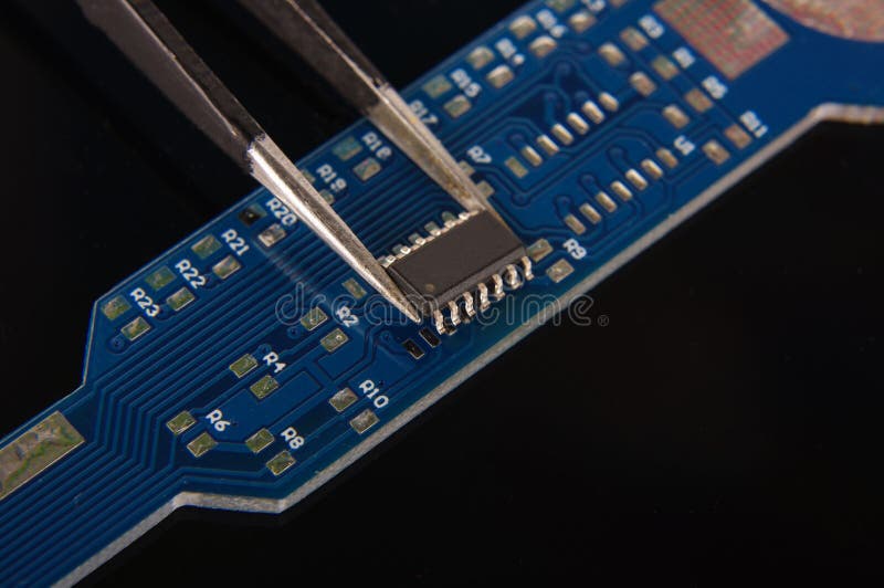 Tiny Integrated Circuit on Empty PCB Board Stock Image - Image of ...
