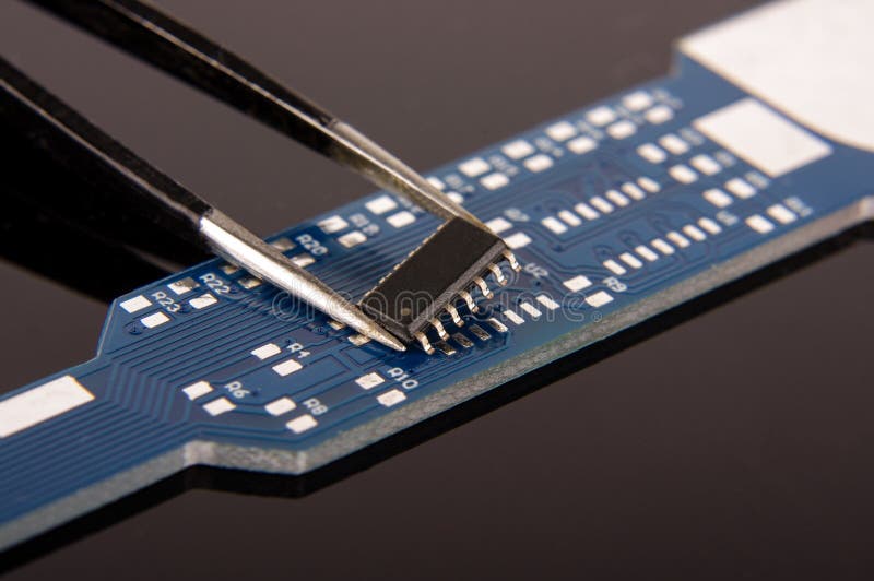 Tiny Integrated Circuit on Empty PCB Board Stock Photo - Image of macro ...